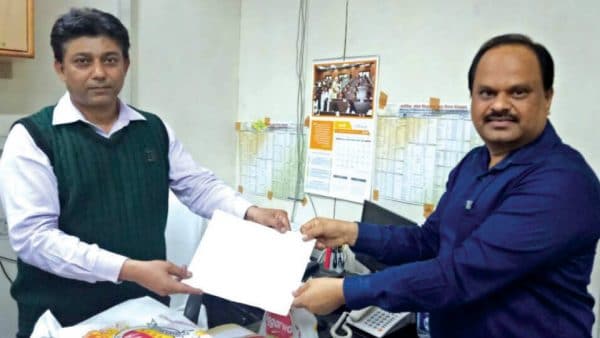Dr. M.R. Ravi receives IAS order copy - Star of Mysore