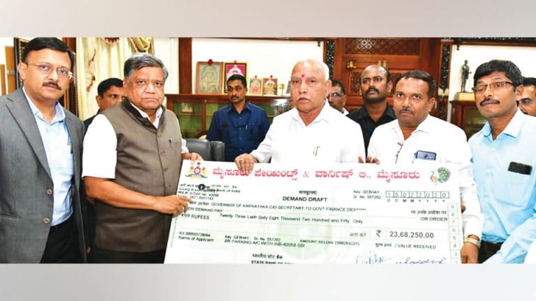 Mysore Paints and Varnish hands over Rs. 23.68 lakh dividend cheque to ...