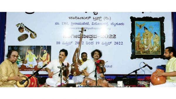 Vid. Mysore M. Nagaraj and Vid. Mysore M. Manjunath presenting a violin ...