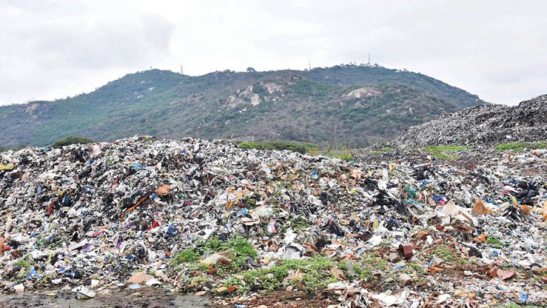 Disposing Mountain of stinking solid waste in city - Star of Mysore